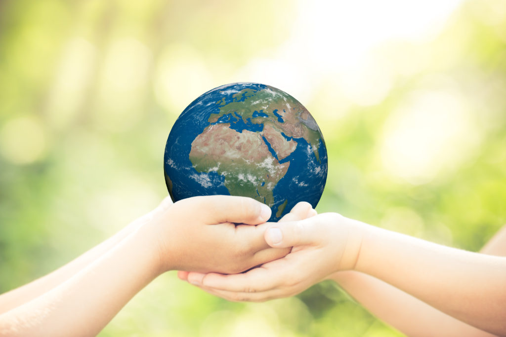 Child holding Earth planet in hands – Welead Global
